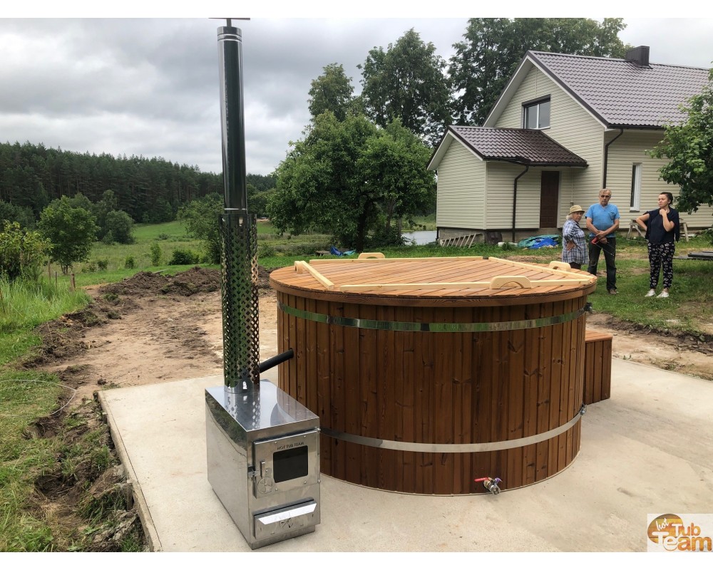 Plastic hot tub with external stove